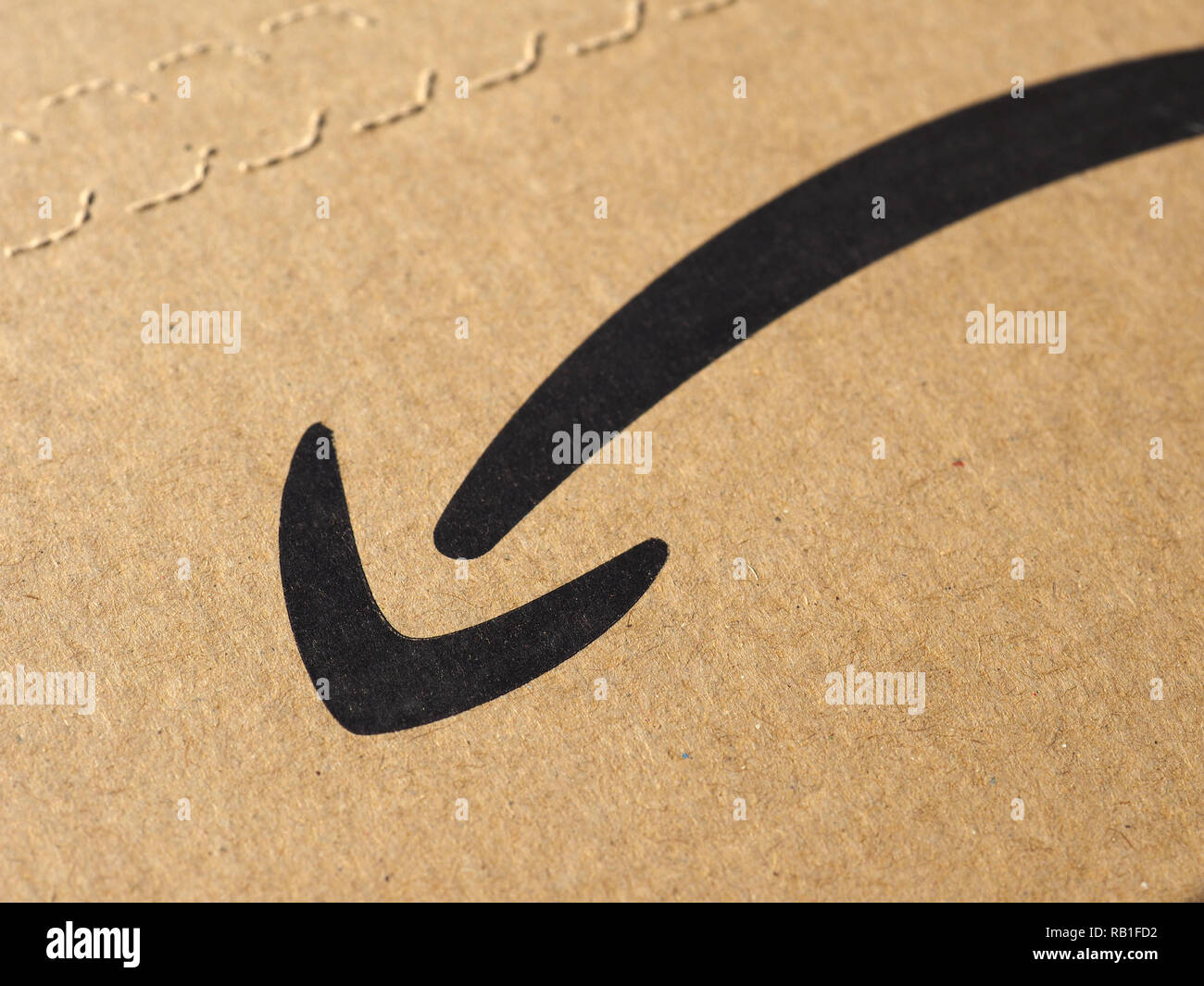 SEATTLE, USA - CIRCA JANUARY 2019: Amazon logo on a cardboard packet ...