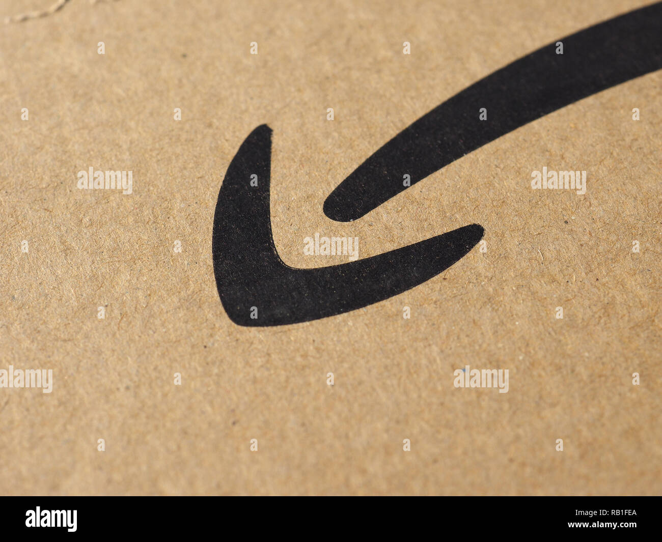 SEATTLE, USA - CIRCA JANUARY 2019: Amazon logo on a cardboard packet ...