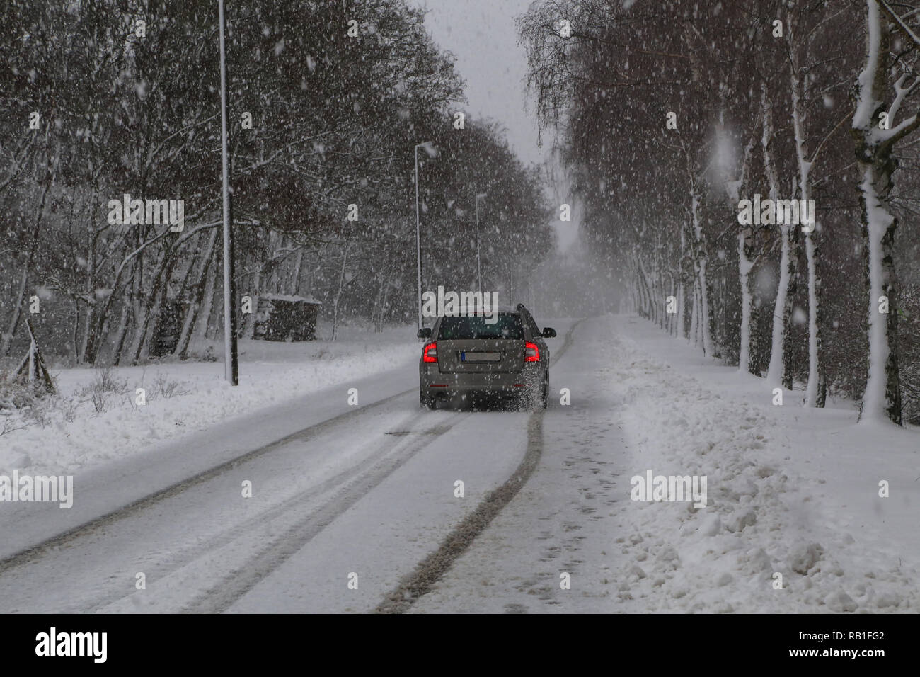 Dangerous winter road after heavy snowfall Stock Photo - Alamy