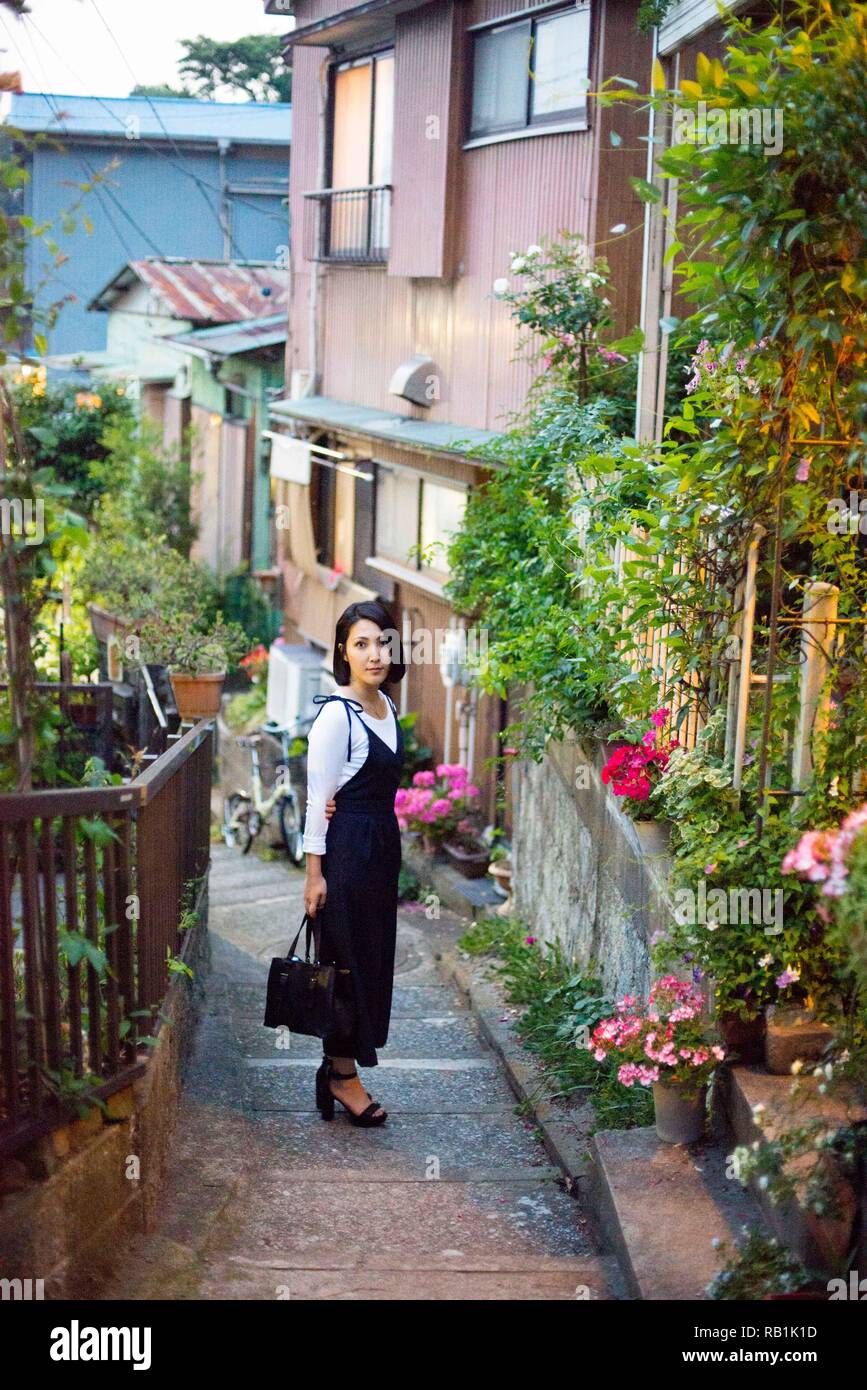 Japanese female model posing for the pictures on the street of Tokyo ...