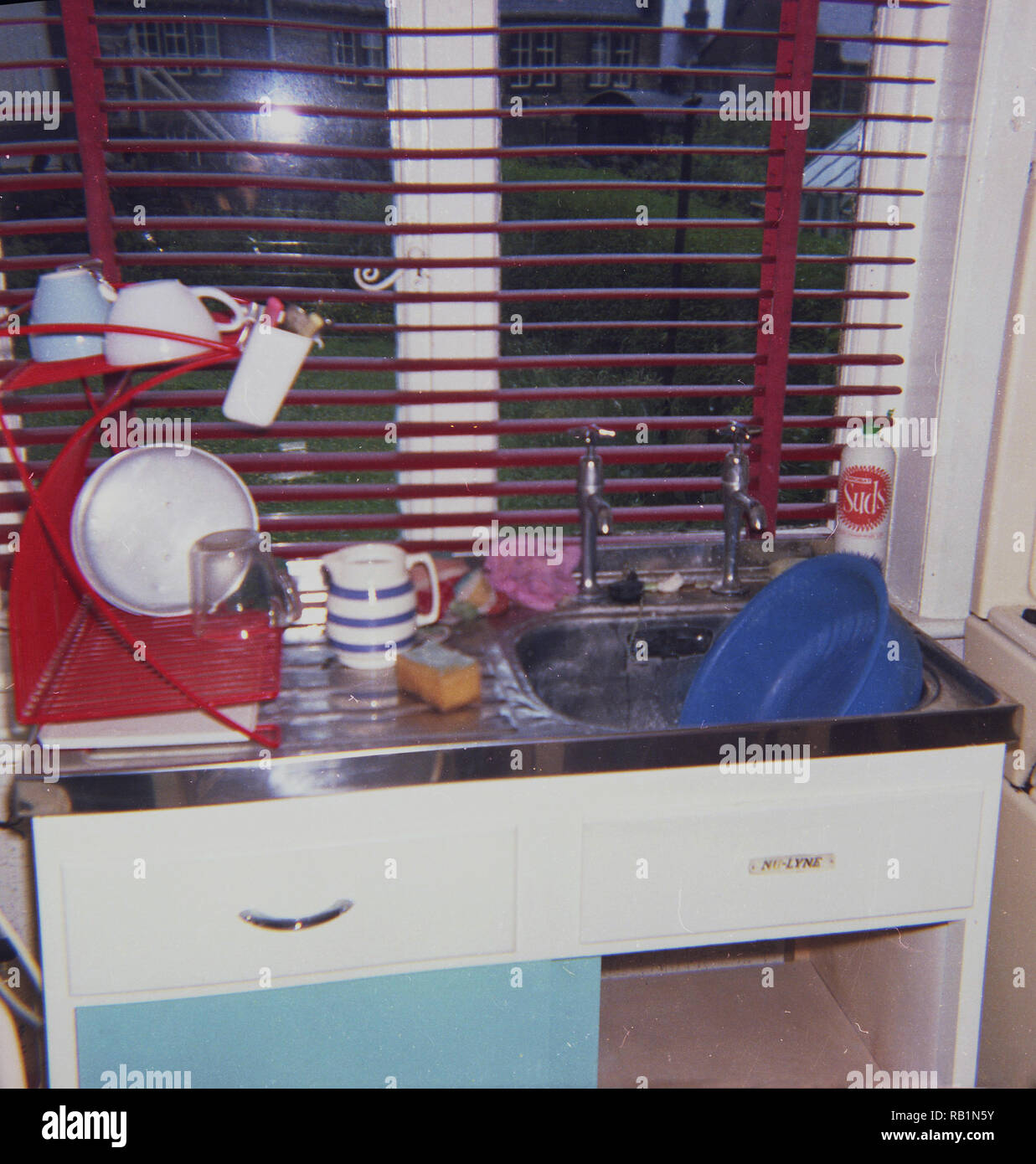 1970s, historical, a small stainless steel kItchen sink and drying area ...