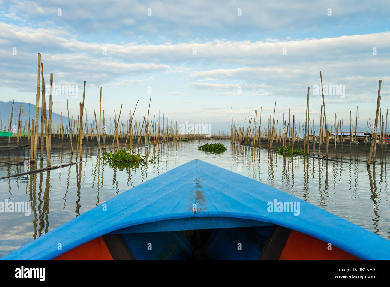 Passing Rawa Pening Lake with a boat Stock Photo - Alamy