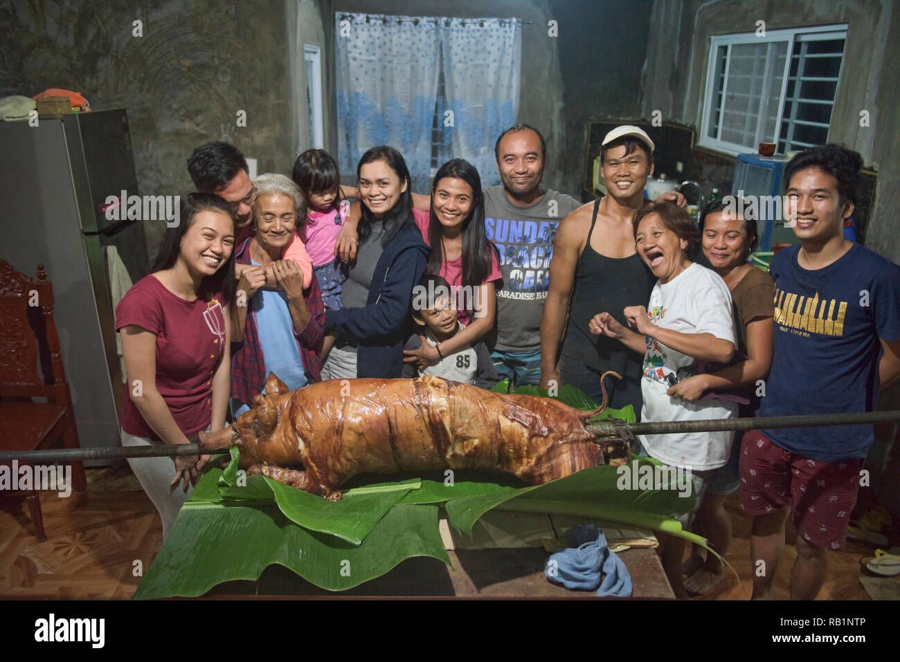 Family gathering and the joys of Lechón, entire roasted pig, a holiday ...