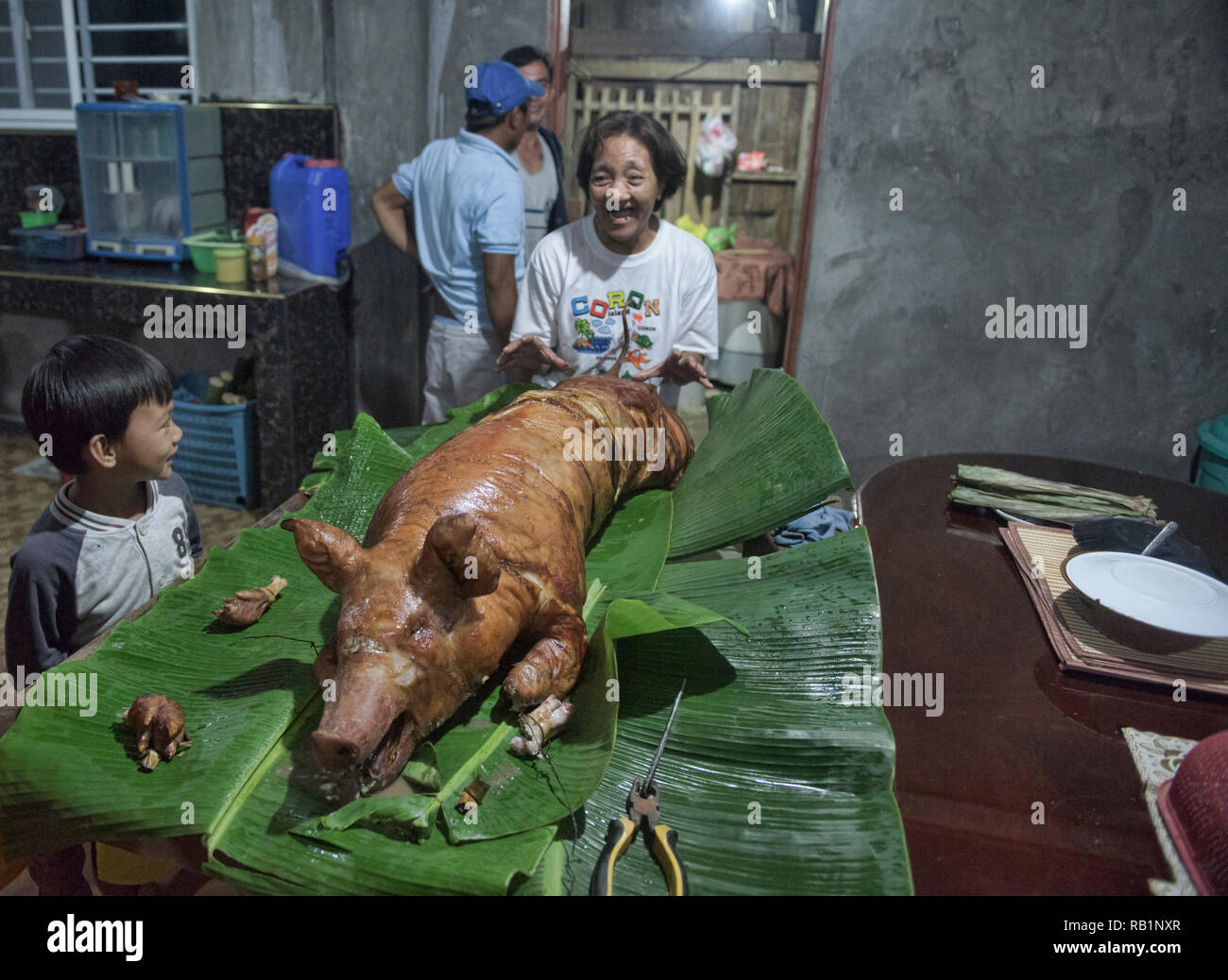 Family gathering and the joys of Lechón, entire roasted pig, a holiday ...