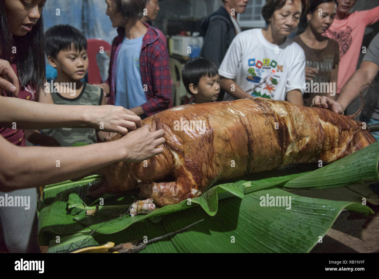 Family gathering and the joys of Lechón, entire roasted pig, a holiday ...
