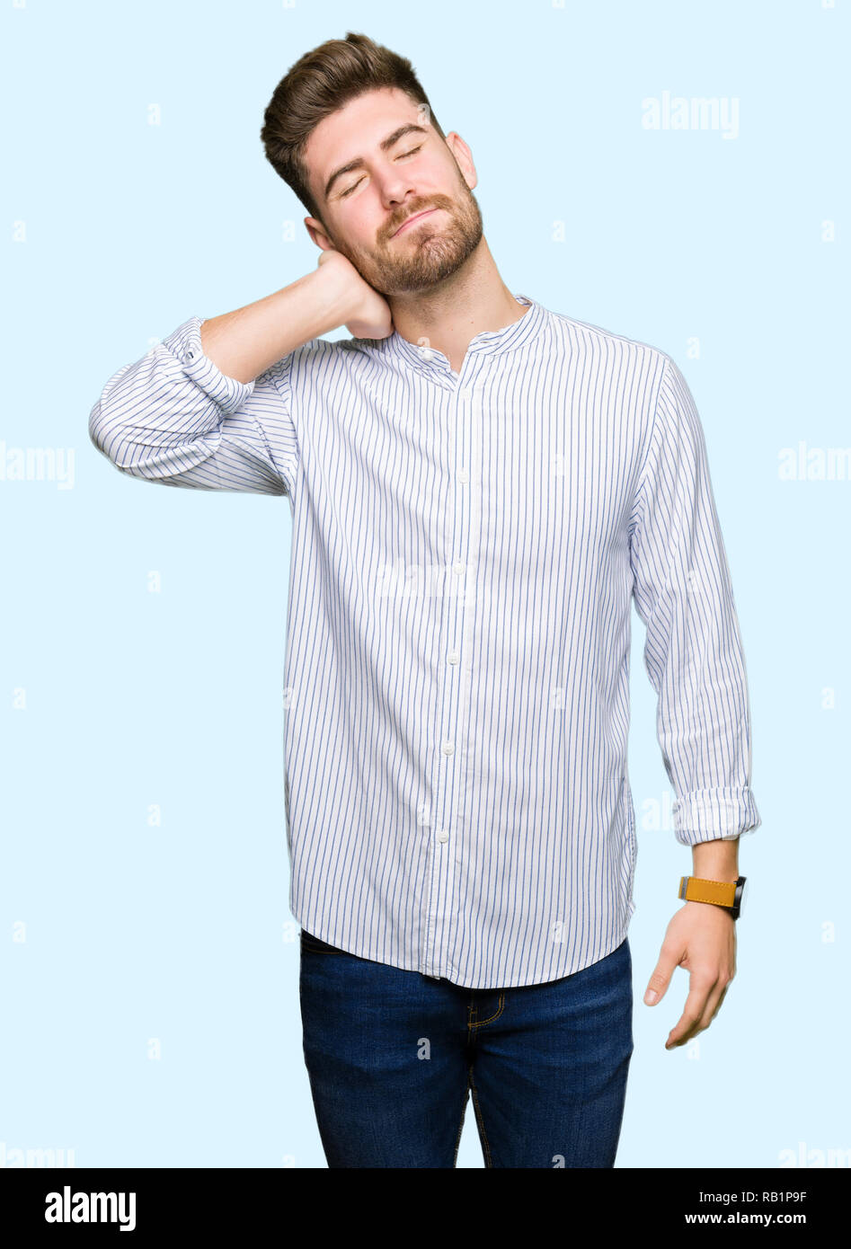 Young handsome man Suffering of neck ache injury, touching neck with ...