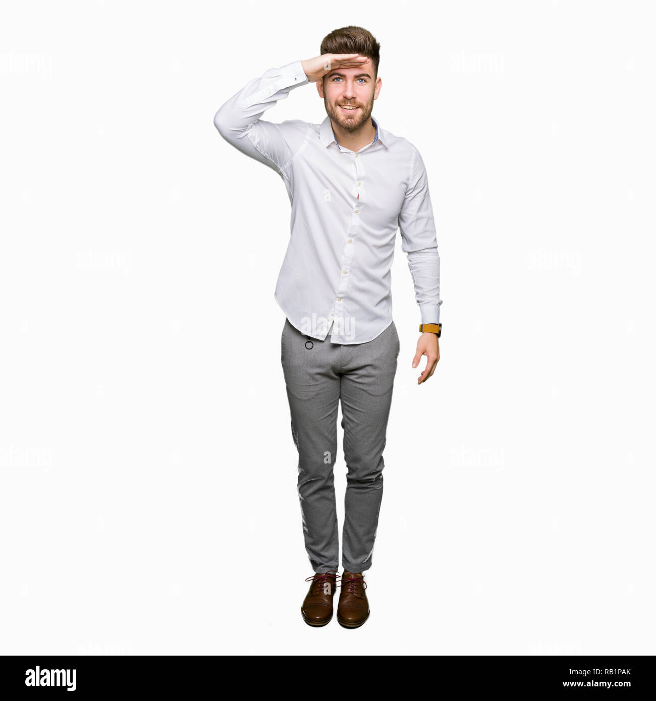 Young handsome business man very happy and smiling looking far away ...