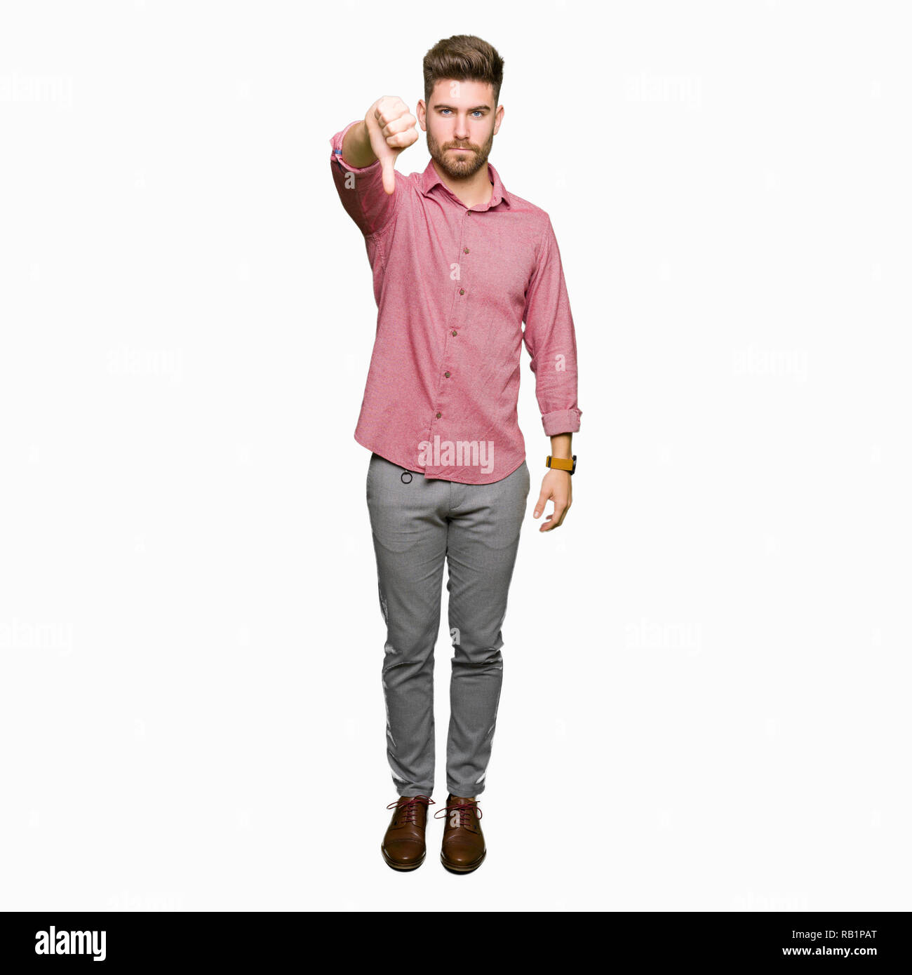 Young handsome business casual man looking unhappy and angry showing ...