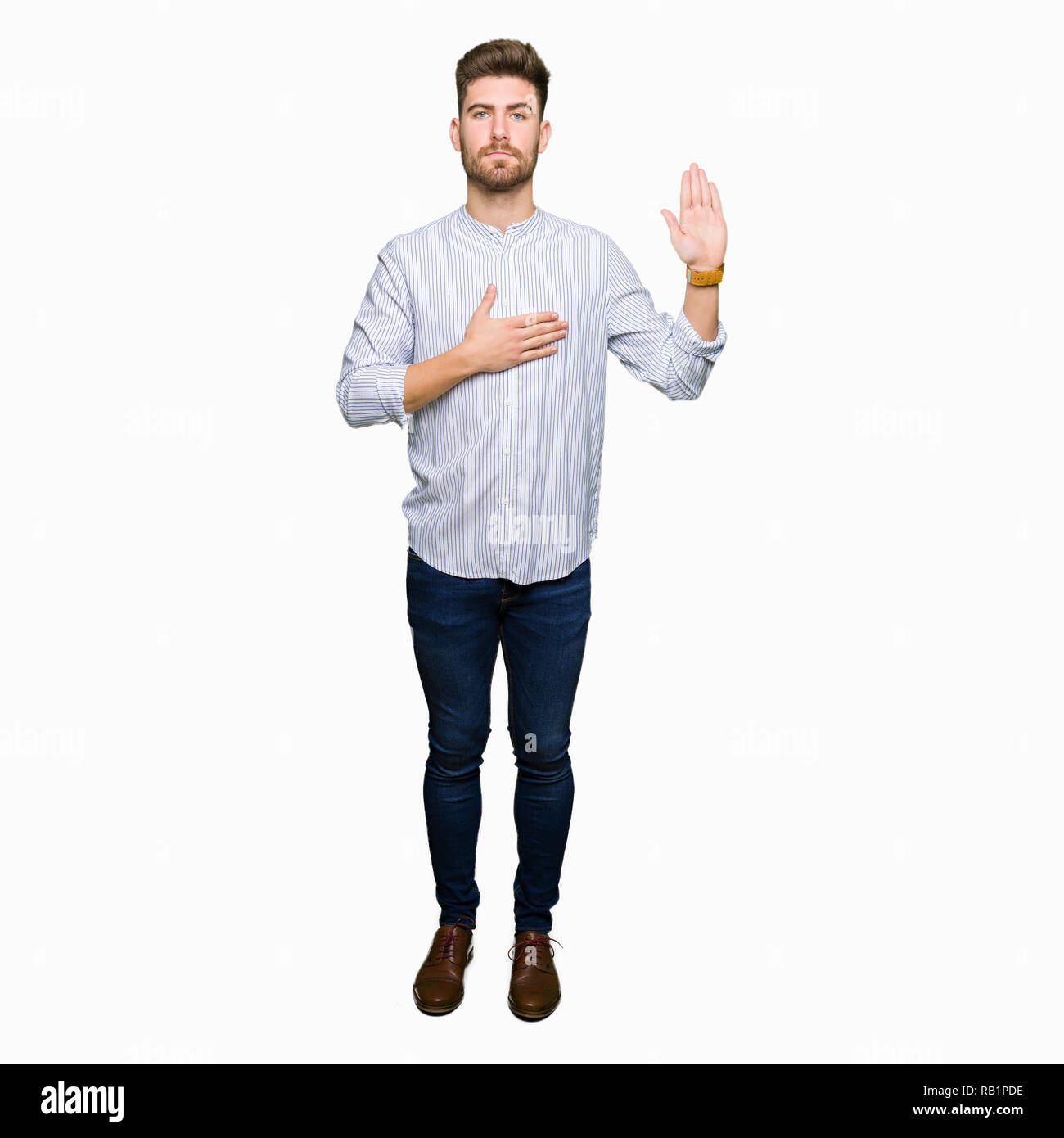 Young handsome man Swearing with hand on chest and open palm, making a ...