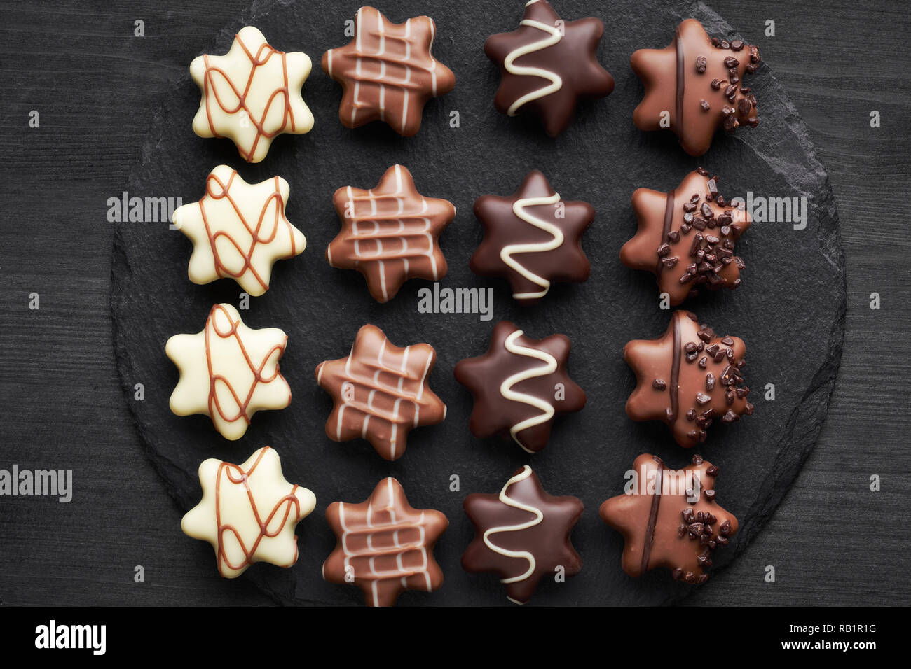 Star-shaped chocolates on dark textured background Stock Photo - Alamy