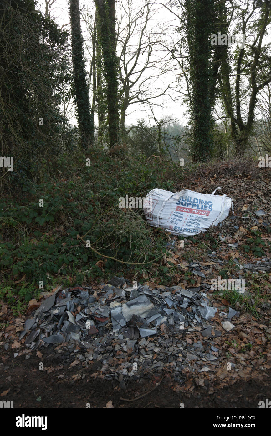 Builders waste dumped in a British country lane Stock Photo - Alamy