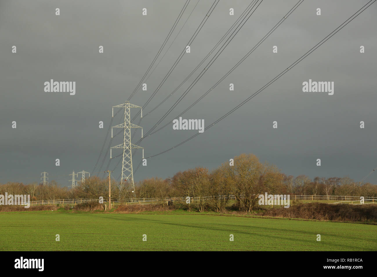 Electricity pylon against dark sky hi-res stock photography and images ...