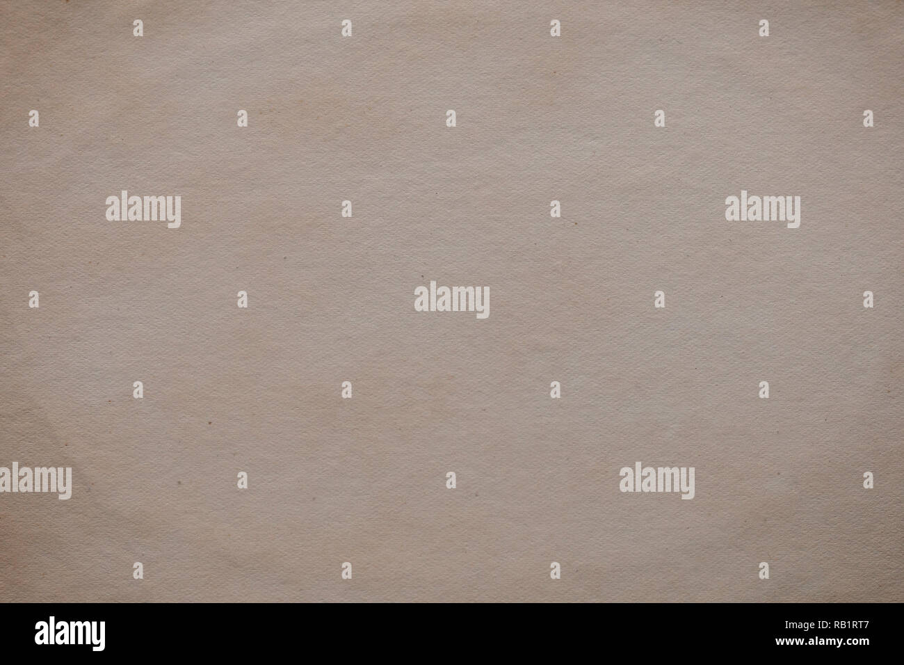 Light beige paper background with old spots. Textured sheet from an old ...