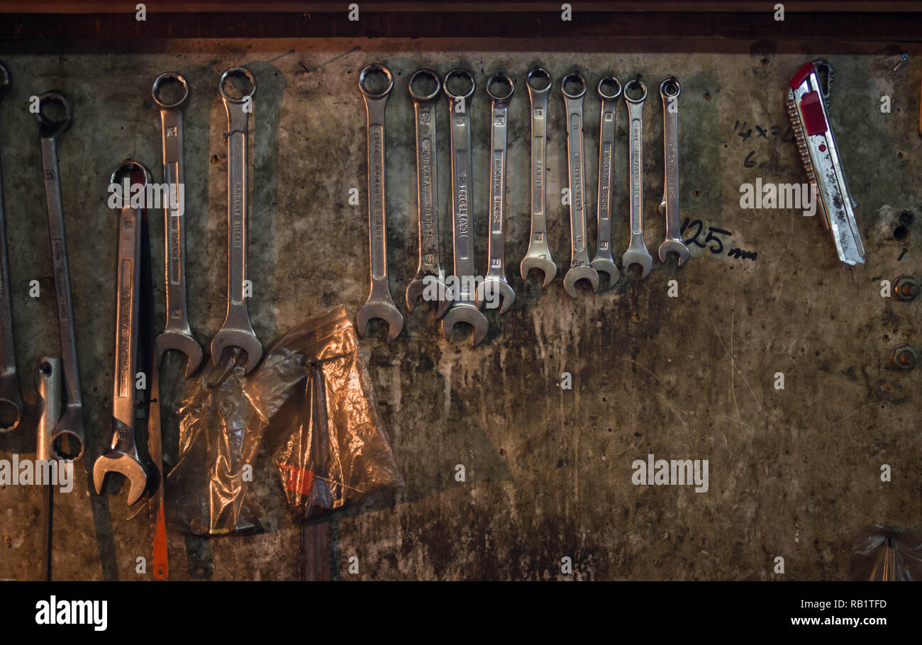 Metal repair tools hanging on the wall of a turner's shop Stock Photo ...