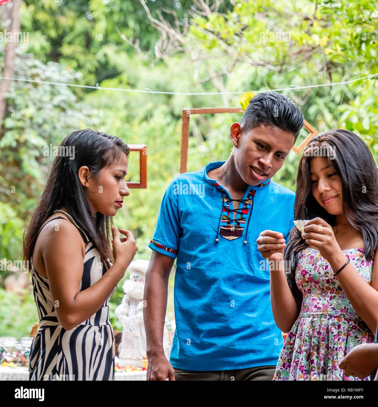 young latin people reading a note in Guatemala Stock Photo - Alamy