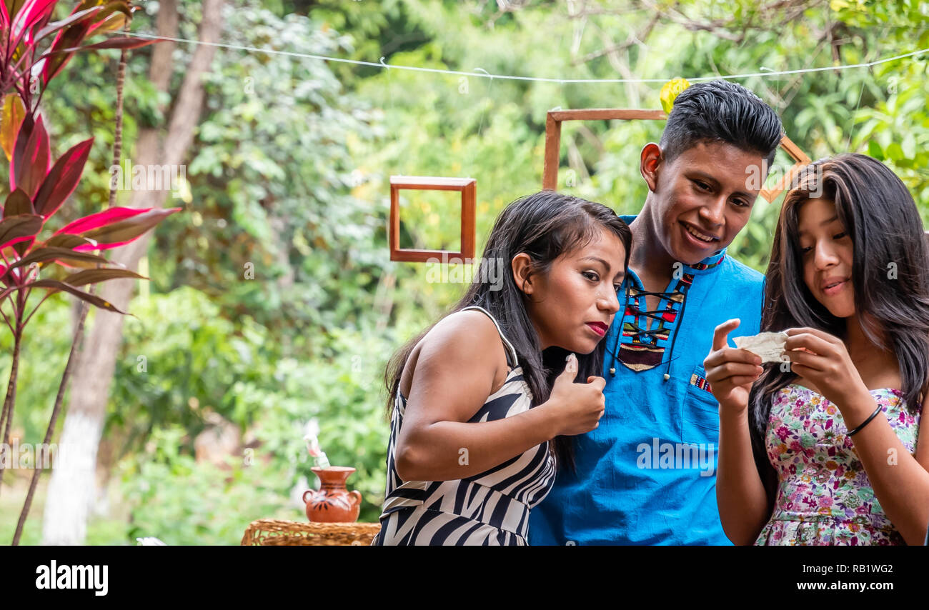 young latin people reading a note in Guatemala Stock Photo - Alamy