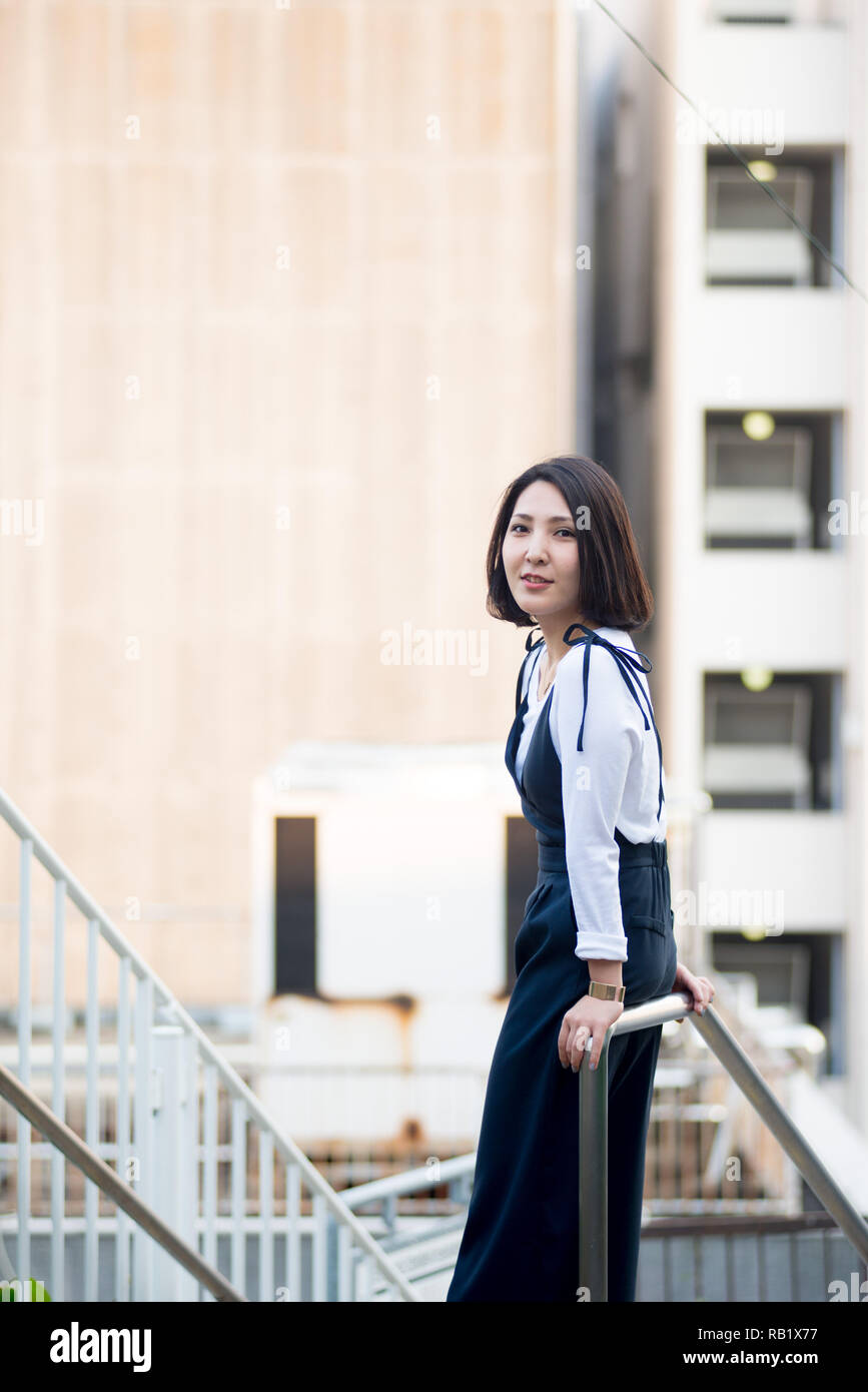 Japanese female model posing for the pictures on the street of Tokyo ...