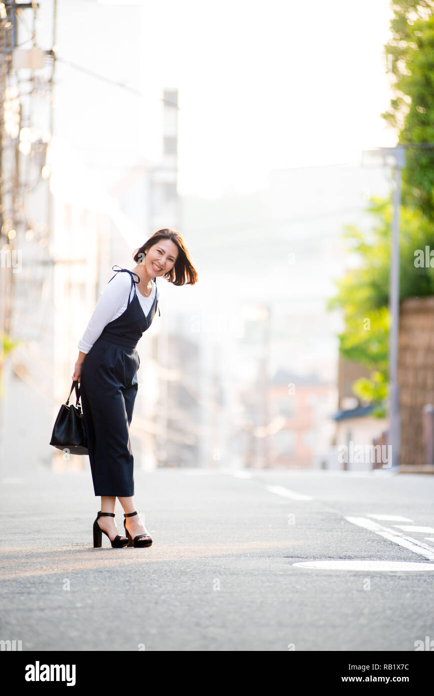 Japanese female model posing for the pictures on the street of Tokyo ...