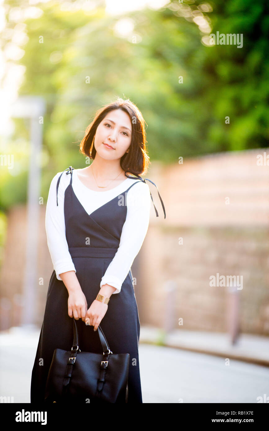 Japanese female model posing for the pictures on the street of Tokyo ...