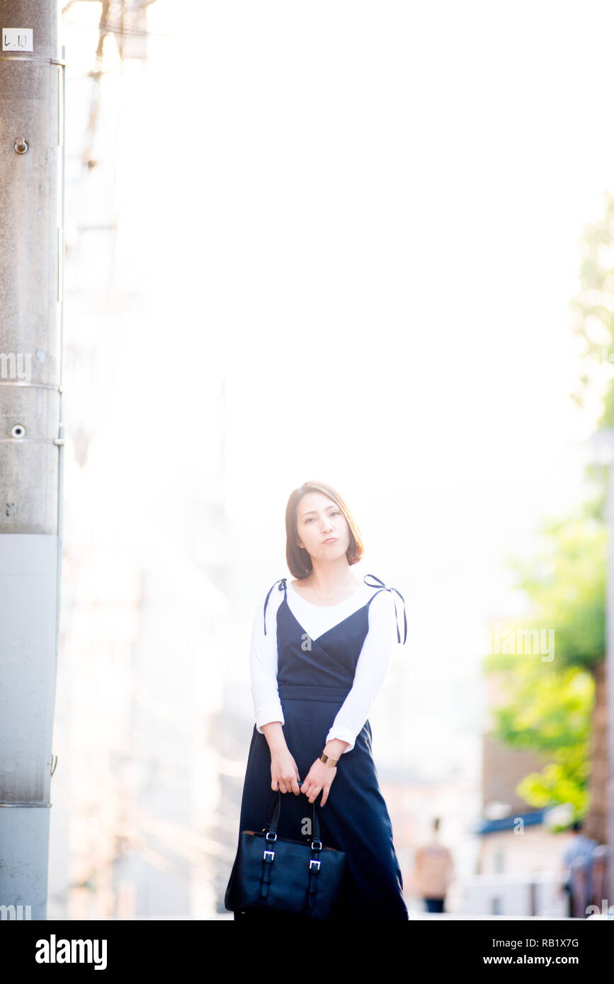 Japanese female model posing for the pictures on the street of Tokyo ...