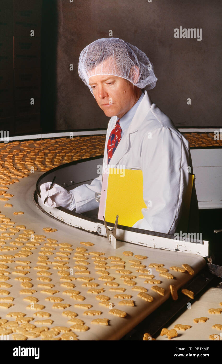 Quality control Manger Inspects Cookies on the cooling line, USA Stock ...