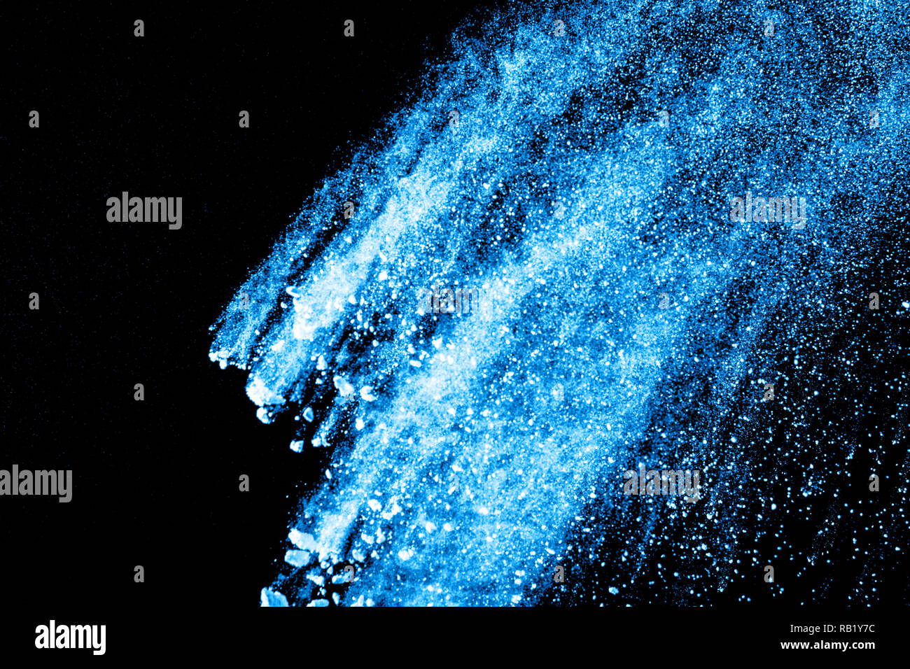 Blue powder explode cloud on black background. Launched blue dust ...