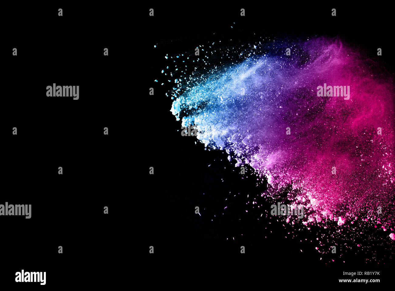 abstract blue-pink dust explosion on black background. abstract blue ...