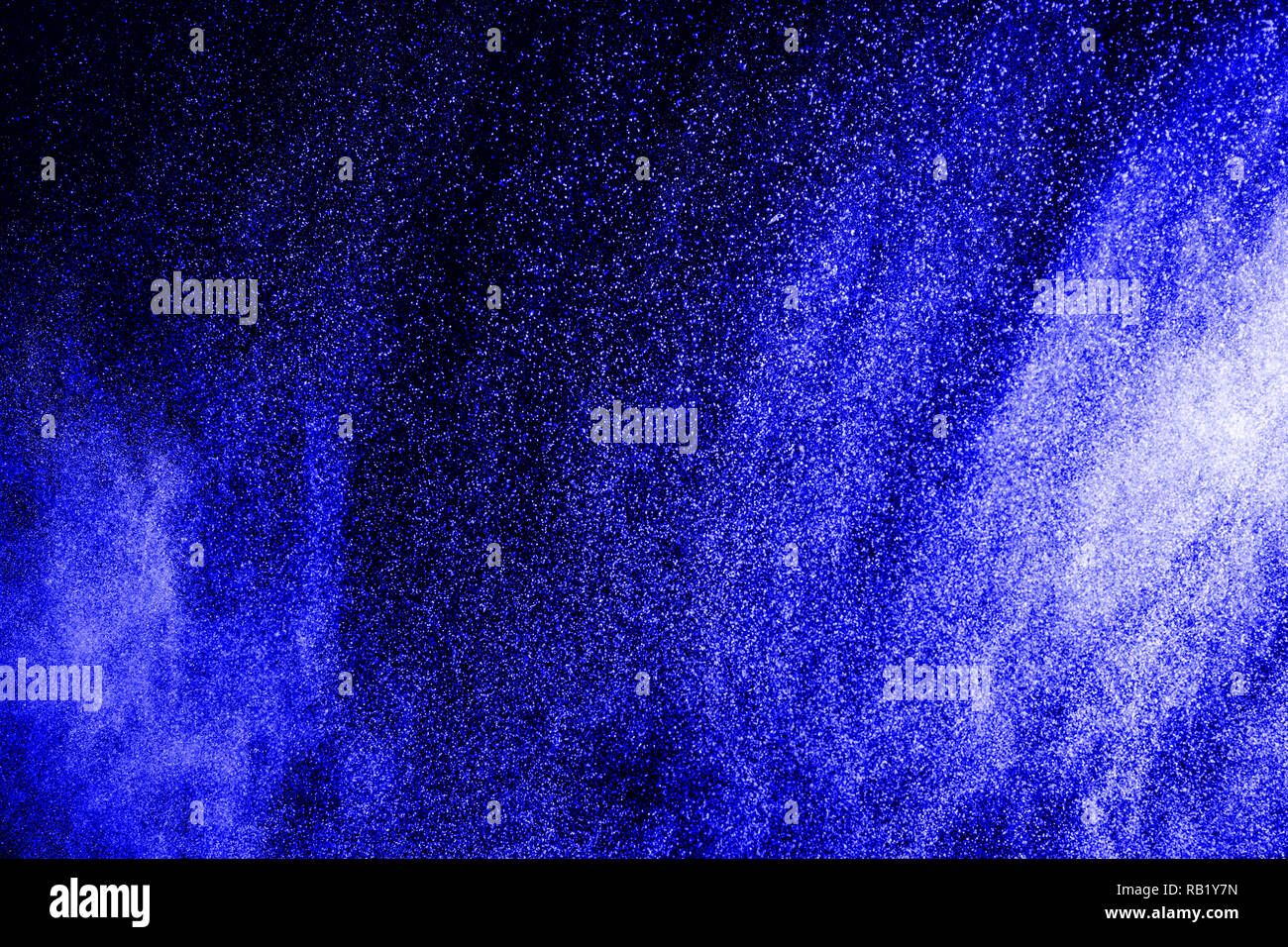 Blue powder explode cloud on black background. Launched blue dust ...