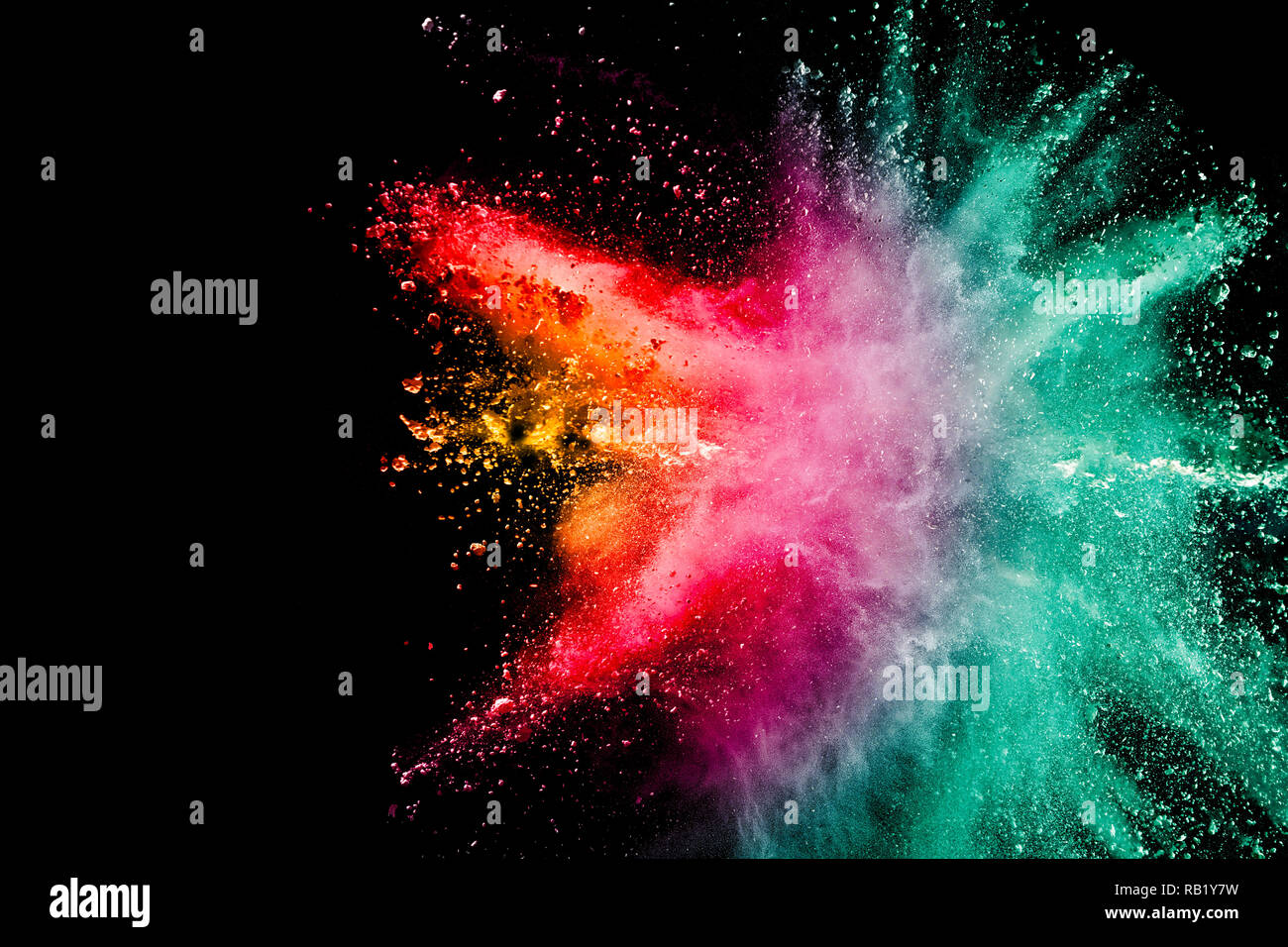 Color powder explosion cloud on black background. Freeze motion of ...