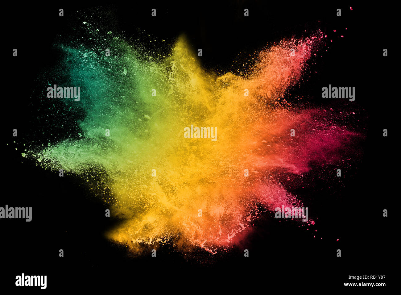 Color powder explosion cloud on black background. Freeze motion of ...