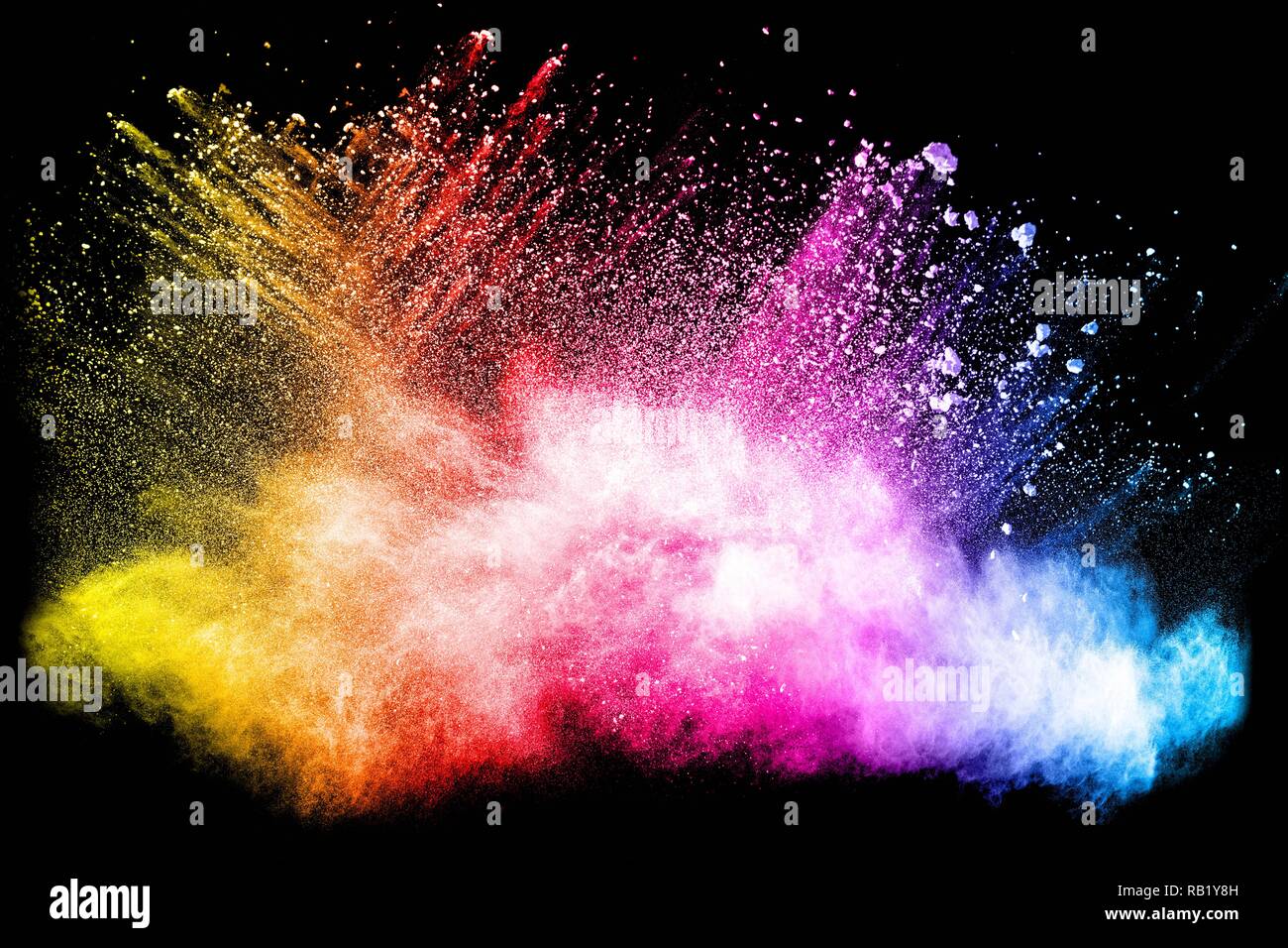 Color powder explosion cloud on black background. Freeze motion of ...