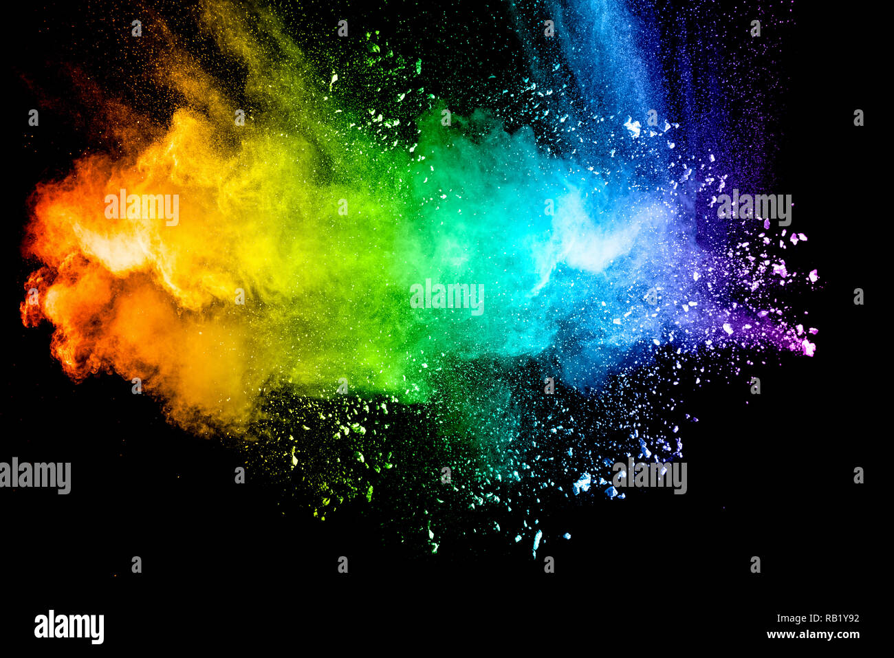 Color powder explosion cloud on black background. Freeze motion of ...