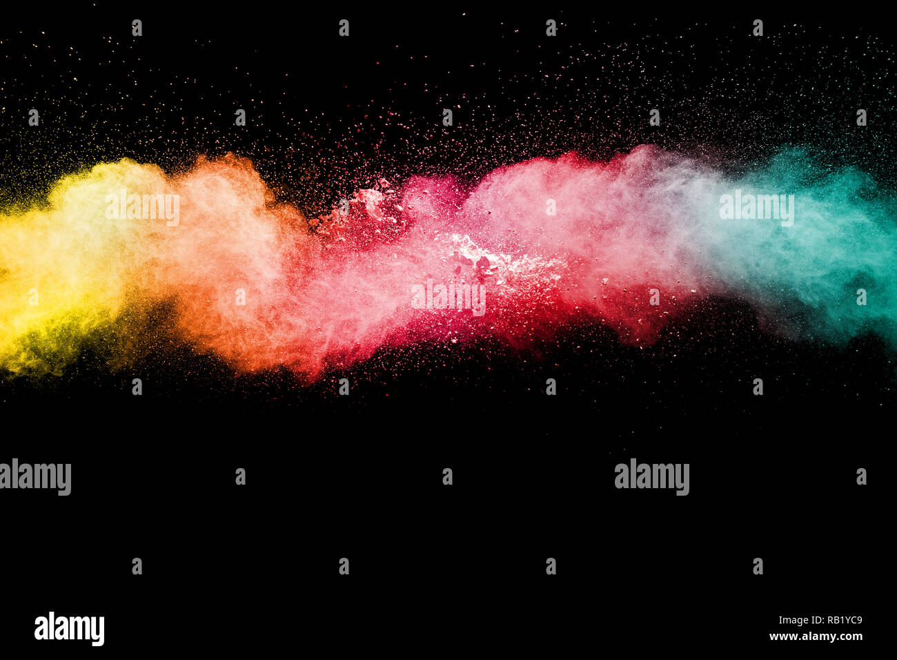 Color powder explosion cloud on black background. Freeze motion of ...