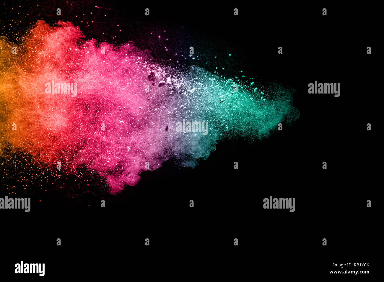 Color powder explosion cloud on black background. Freeze motion of ...