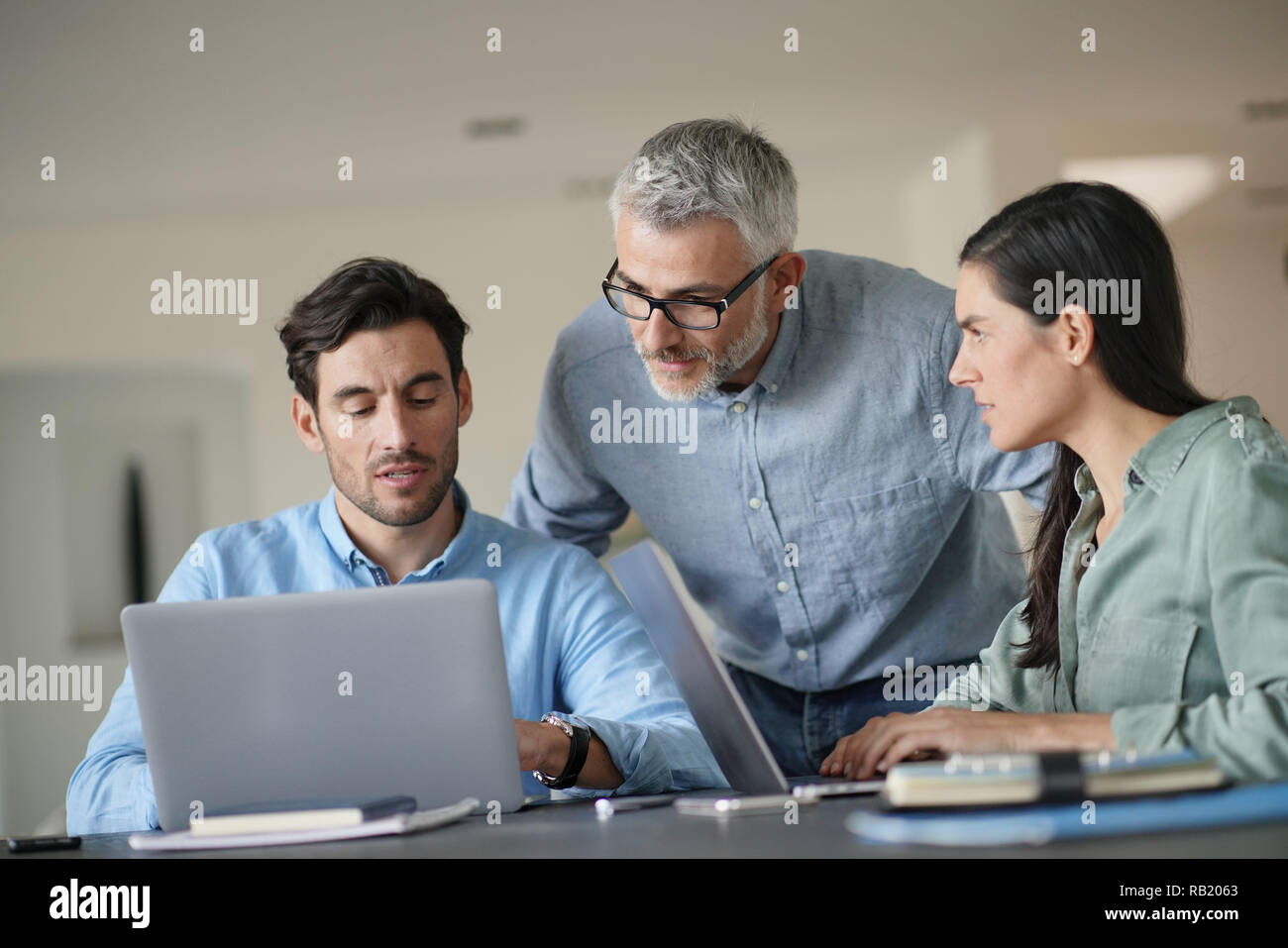 Young employee with older employee hi-res stock photography and images ...