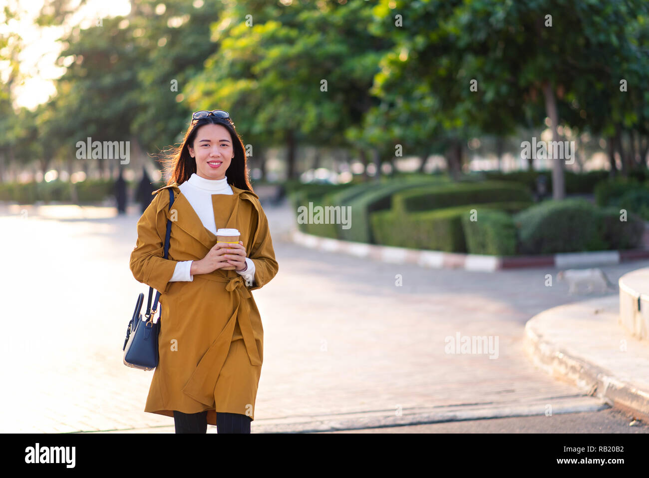 Woman street coffee walking hi-res stock photography and images - Alamy
