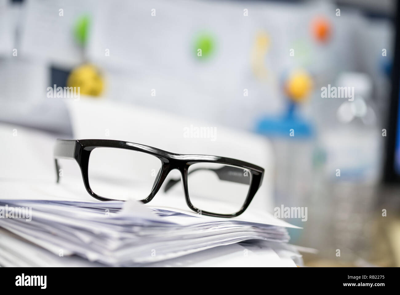 Paper heap from hard work is under black glass Stock Photo - Alamy