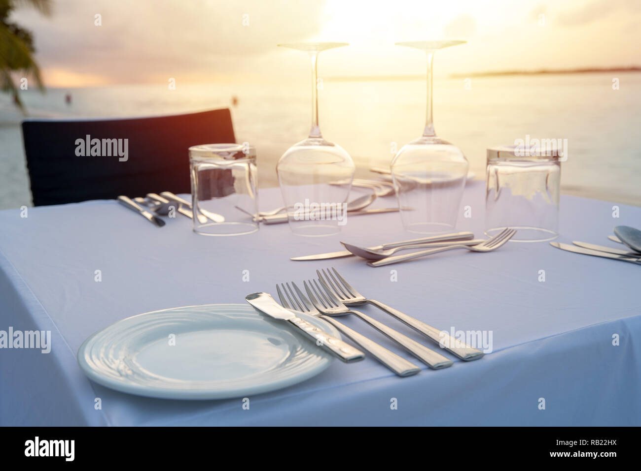 Table outdoor next to sea scenic prepare for special romantic dinner ...