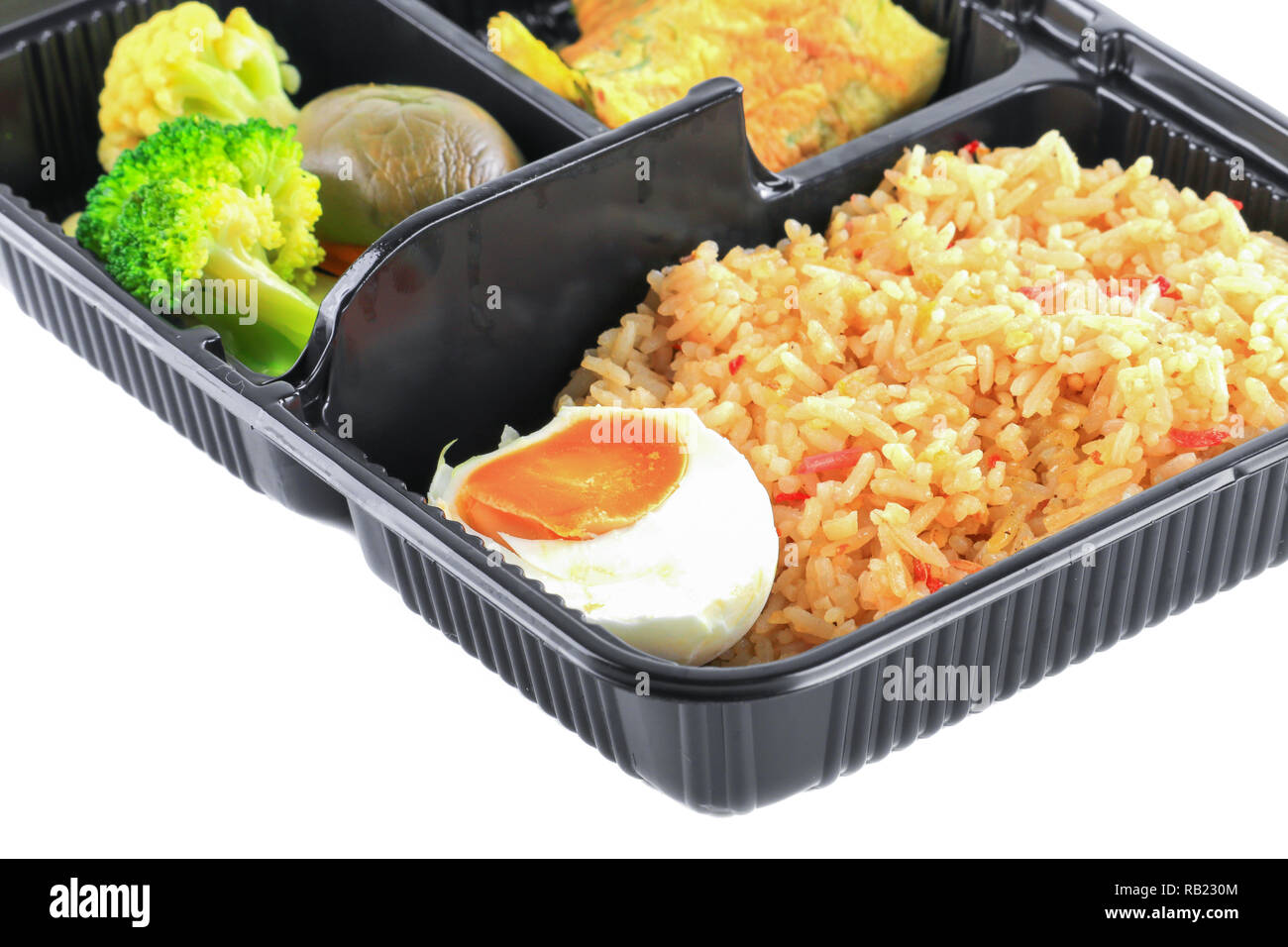 close up fried rice with egg and vegetables in lunch box set on white background Stock Photo - Alamy