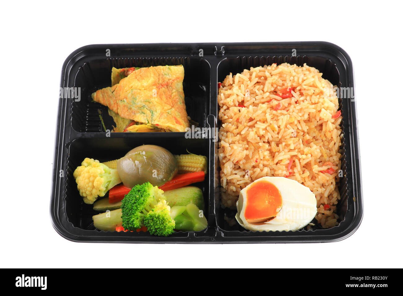 close up fried rice with egg and vegetables in lunch box set on white ...