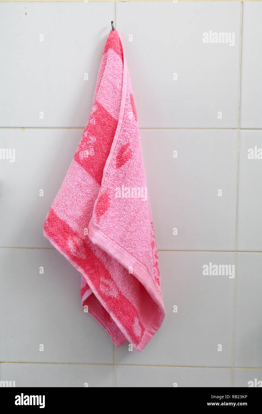 red towel for wipe hand in toliet room on wall Stock Photo - Alamy