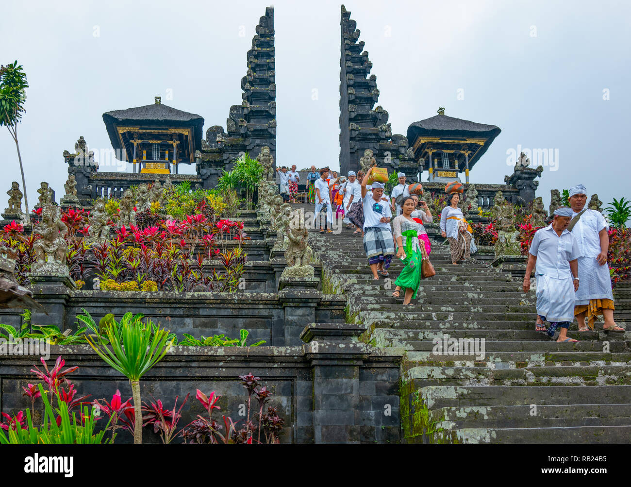 Bali, Indonesia - March 23, 2017: Faithful descending the long ...