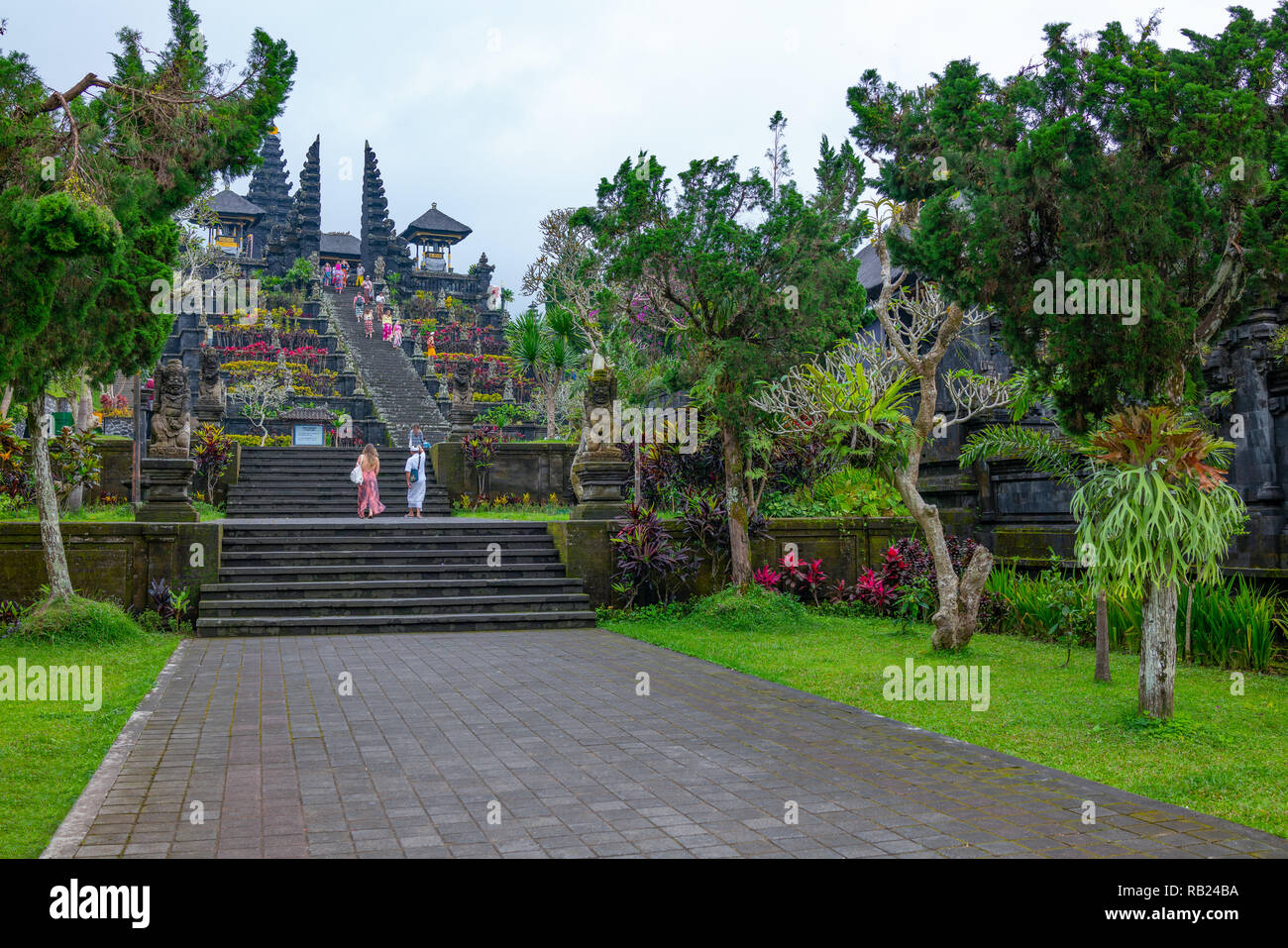 Bali, Indonesia - March 23, 2017: Faithful descending the long ...