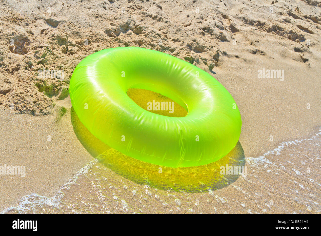 A green buoy ison beach Stock Photo - Alamy