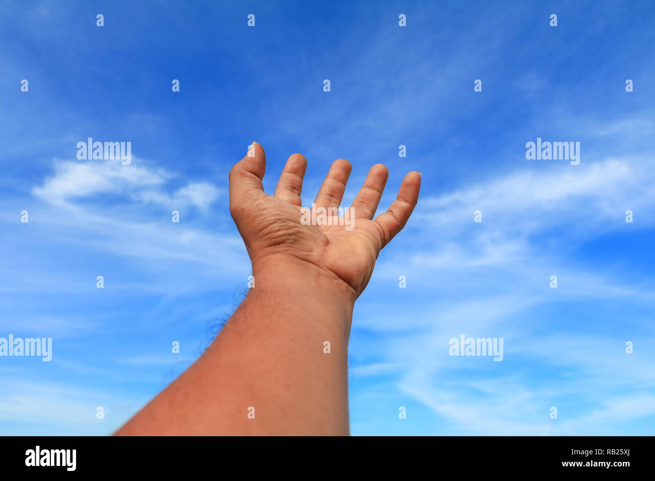hand open on sky background Stock Photo - Alamy