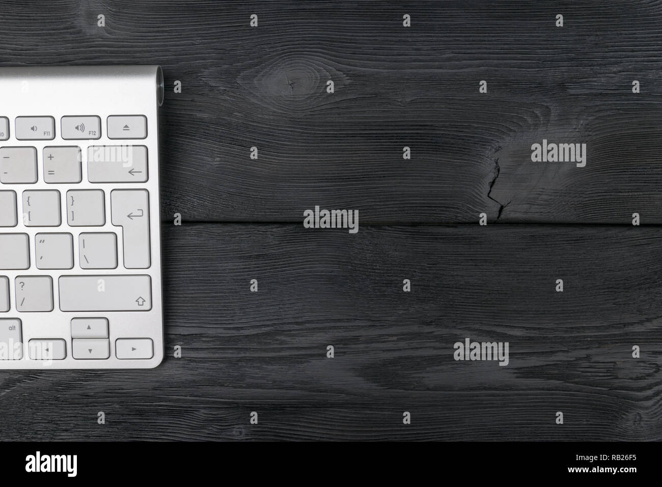 Close up view of a workplace with wireless computer keyboard, keys on ...