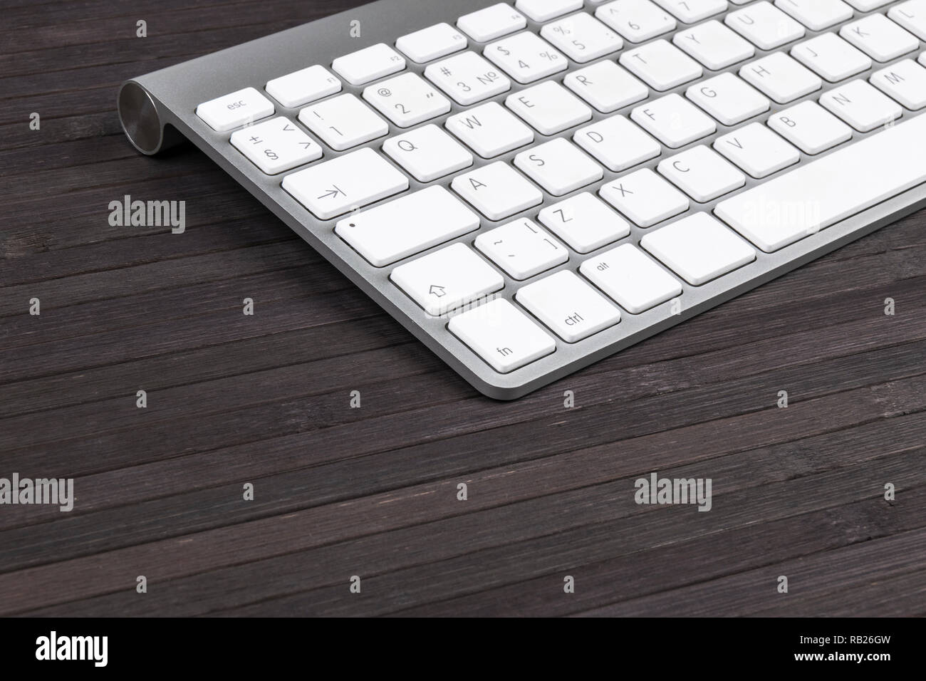 Close up view of a business workplace with wireless computer keyboard ...