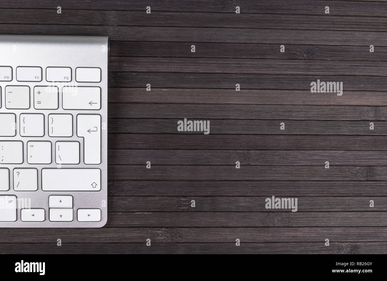 Close up view of a business workplace with wireless computer keyboard ...
