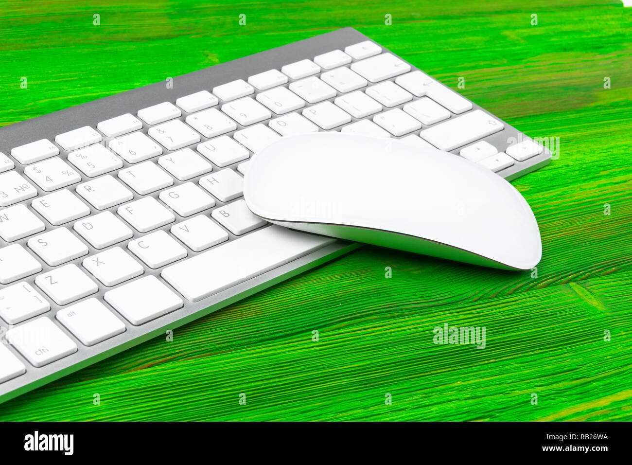 Business workplace with computer, wireless keyboard, keys and mouse on ...