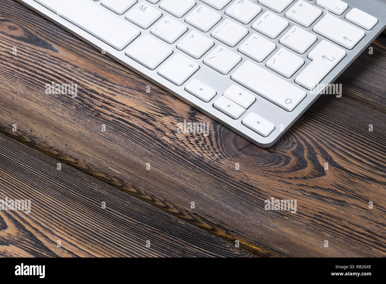 Close up view of a business workplace with wireless computer keyboard ...